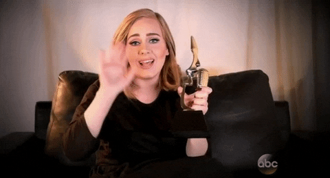 Adele Waving Hi While Holding Trophy GIF | GIFDB.com