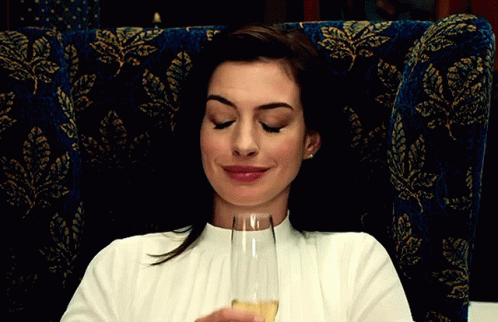Anne Hathaway Holding Champagne Glass GIF | GIFDB.com