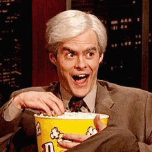 Bill Hader Snl Excitedly Eating Popcorn Meme GIF | GIFDB.com