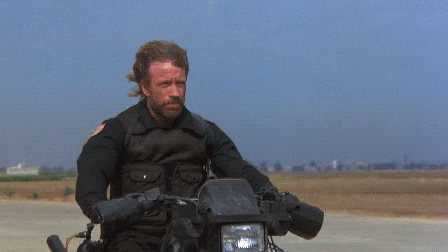 Chuck Norris Firing Guns Through Motorcycle GIF | GIFDB.com