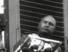 Confident Benito Mussolini Crossing Arms GIF | GIFDB.com