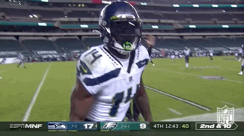 Dk Metcalf Throwing Football GIF | GIFDB.com