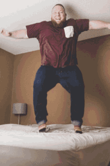 Fully Grown Man Jumping On The Bed GIF | GIFDB.com