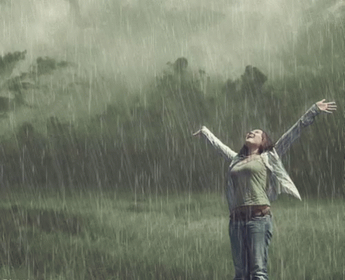 Happy Woman Enjoying Rain GIF | GIFDB.com