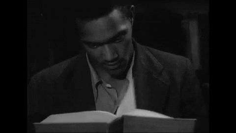 Man Reading Book During 40s GIF | GIFDB.com