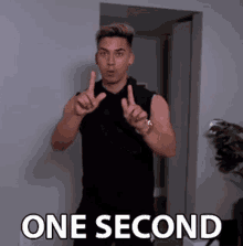 One Sec Man In Black GIF | GIFDB.com