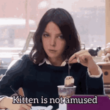 Serious Girl Dipping Tea Bag In Cup GIF | GIFDB.com