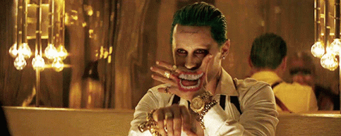 Suicide Squad Joker Laughing Mouth In His Hand GIF | GIFDB.com
