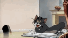 Tom Laughing Reading Book GIF | GIFDB.com