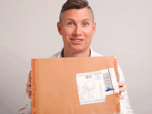 Whats In The Box Smiling Delivery Guy GIF | GIFDB.com