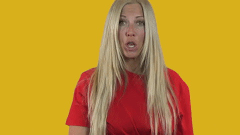 Woman Playing Imaginary Smallest Violin GIF | GIFDB.com