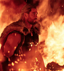 Actor Chris Hemsworth As Thor Walking On Fire GIF | GIFDB.com
