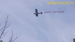 Airplane Banner Display In The Sky GIF | GIFDB.com