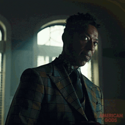American Gods Mr Nancy Slow Laughing GIF | GIFDB.com