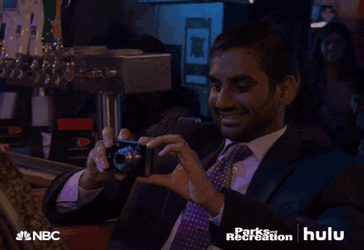Aziz Ansari Taking Pictures Parks And Recreation GIF | GIFDB.com