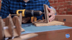 Cardboard Drill Hole GIF | GIFDB.com