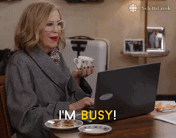 Catherine O Hara Pretending To Work Im Busy GIF | GIFDB.com