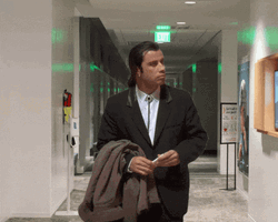 Confused Actor John Travolta In The Hallway GIF | GIFDB.com