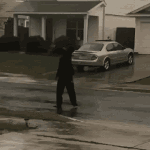 Man Standing In The Rain Gif