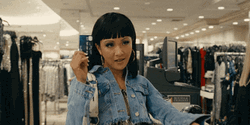 Constance Wu Holding Up Credit Card GIF | GIFDB.com
