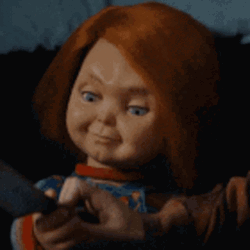 Creepy Chucky Holding Knife GIF | GIFDB.com
