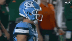 Drake Maye Chest Bump With Teammate GIF | GIFDB.com