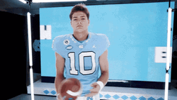 Drake Maye Making Football Spin In Air GIF | GIFDB.com