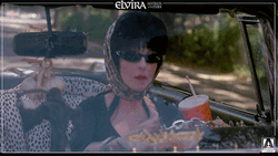 Elvira Cheering While Driving GIF | GIFDB.com