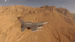 Fighter Jet Flying Over Deserted Area GIF | GIFDB.com