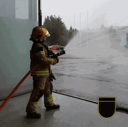 Firefighter Holding Fire Hose GIF | GIFDB.com
