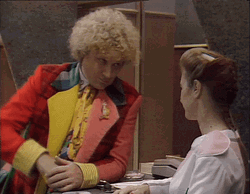 Flirty Colin Baker Flower Magic GIF | GIFDB.com
