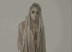 Girl With Dreads Looks Over Your Head GIF | GIFDB.com