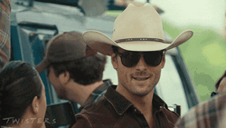 Glen Powell Hat Salute Twisters GIF | GIFDB.com