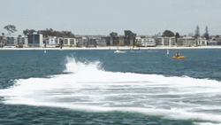 Guy Fly Boarding Near Parked Skiff GIF | GIFDB.com