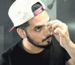 Guy Looks Mirror Pinch Scab GIF | GIFDB.com