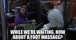 Guy Offering Foot Massage While Waiting GIF | GIFDB.com