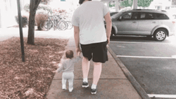 Guy Walking With His Baby On The Sidewalk GIF | GIFDB.com