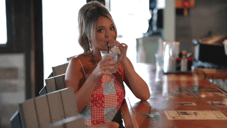 Happy Woman Raising Glass Of Margarita GIF | GIFDB.com