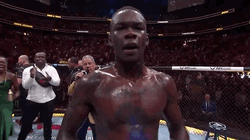 Israel Adesanya Making Himself Smile GIF | GIFDB.com