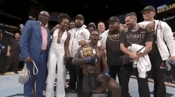 Israel Adesanya Taking Photo With Team GIF | GIFDB.com