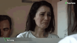 Lady Trying Not To Cry In Front Of Mirror GIF | GIFDB.com