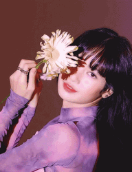 Lisa Of Blackpink Holding Flower To Her Face GIF | GIFDB.com