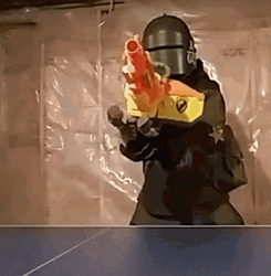 Mask Man Preparing The Machine Gun GIF | GIFDB.com