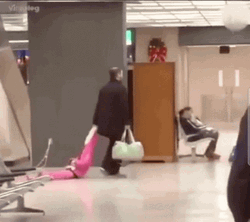 Man Dragging Someone On The Airport GIF | GIFDB.com
