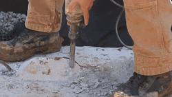 Man Holding The Head Of A Jackhammer GIF | GIFDB.com