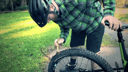 Man Removing Dog Poop From Bicycle Tire GIF | GIFDB.com