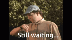 Man Staring At His Watch Still Waiting GIF | GIFDB.com