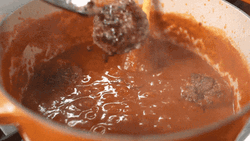 Meatball Being Thrown Into Saucepan GIF | GIFDB.com