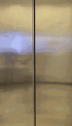 Mike O'hearn Exiting Elevator In Red Tee GIF | GIFDB.com