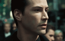 Neo Wearing Shades In Crowded Place In Matrix GIF | GIFDB.com